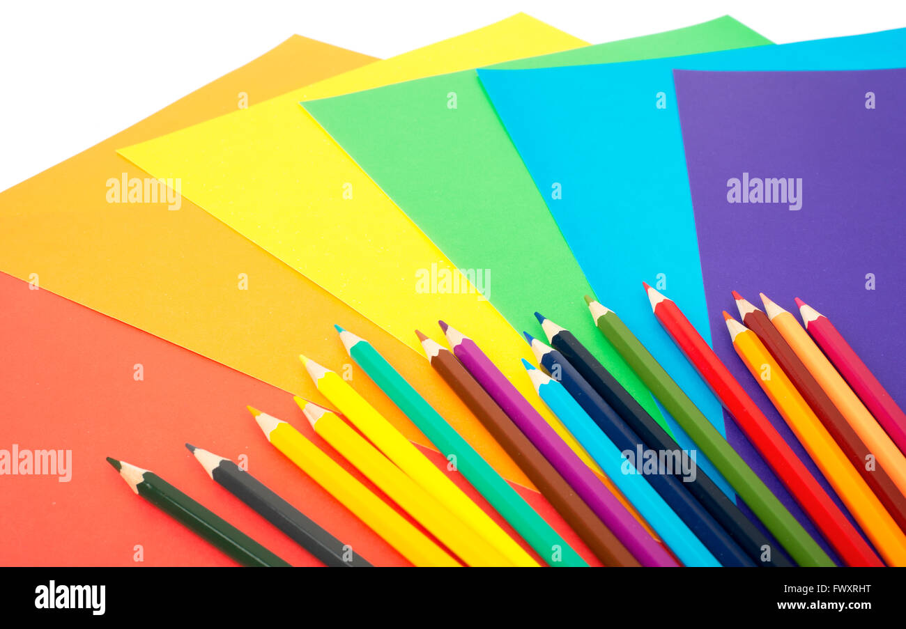 Crayons with colorful paper Stock Photo - Alamy