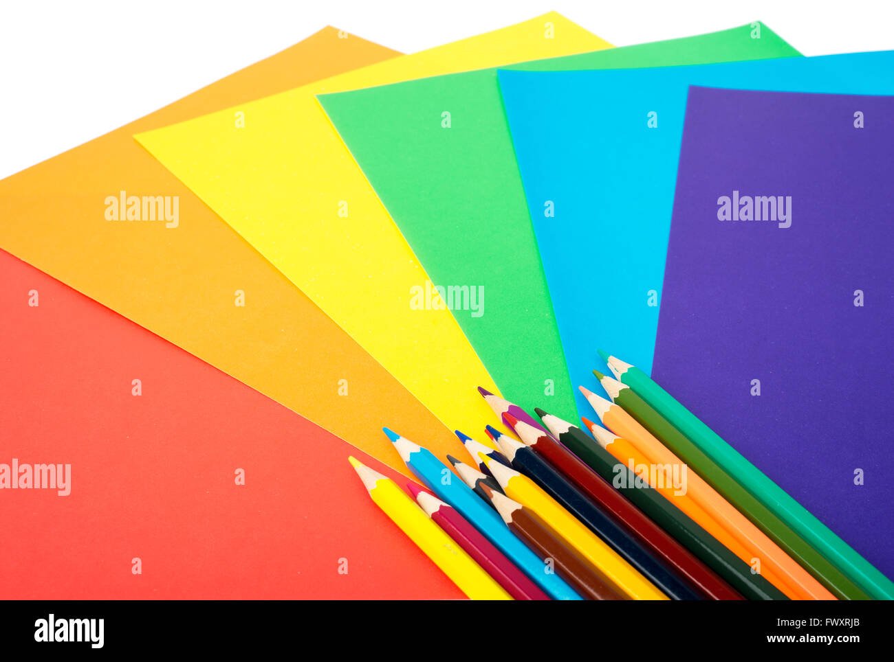 Crayons with colorful paper Stock Photo - Alamy