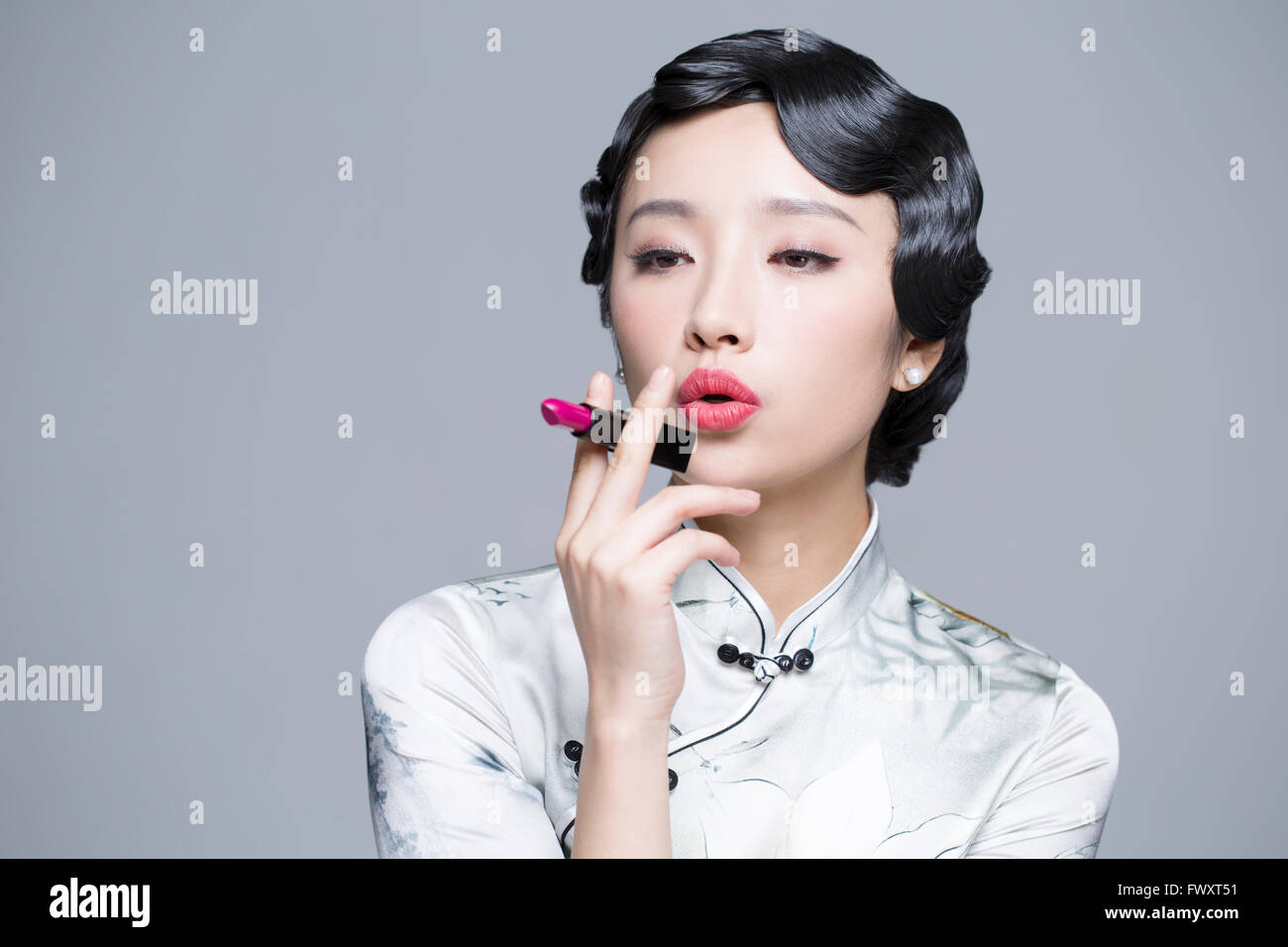 Young beautiful woman in traditional cheongsam with a lipstick Stock ...