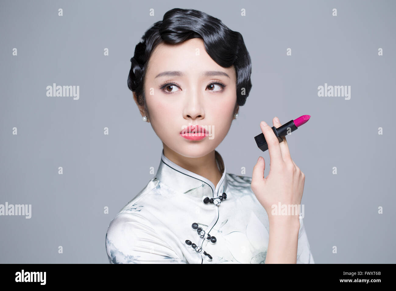 Young beautiful woman in traditional cheongsam with a lipstick Stock ...