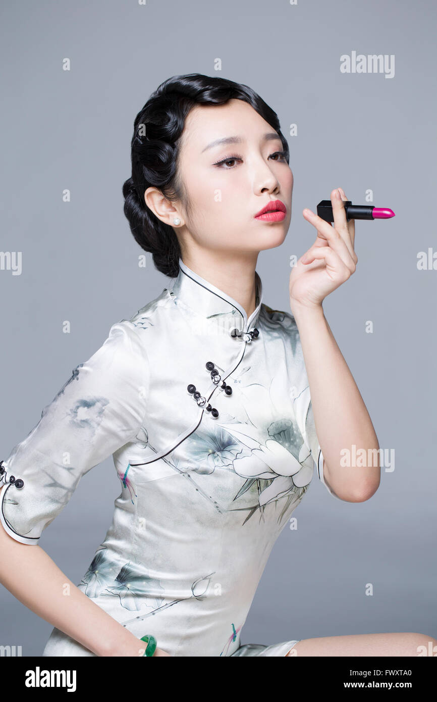Young beautiful woman in traditional cheongsam with a lipstick Stock ...