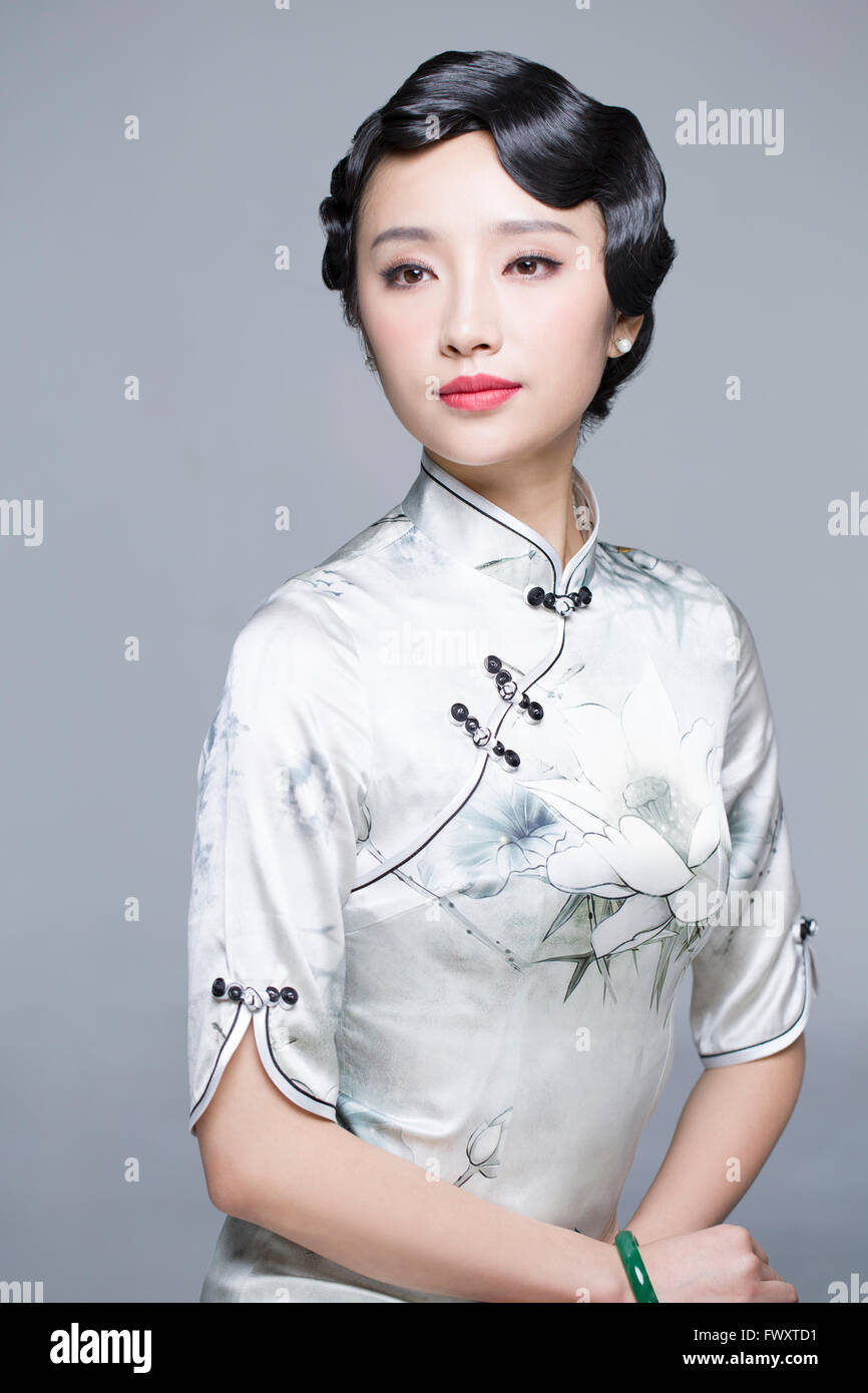 Young beautiful woman in traditional cheongsam Stock Photo - Alamy