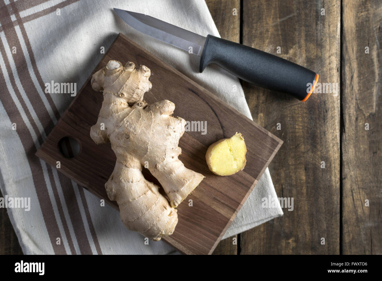Fresh ginger root on a cutting board, from above Stock Photo - Alamy