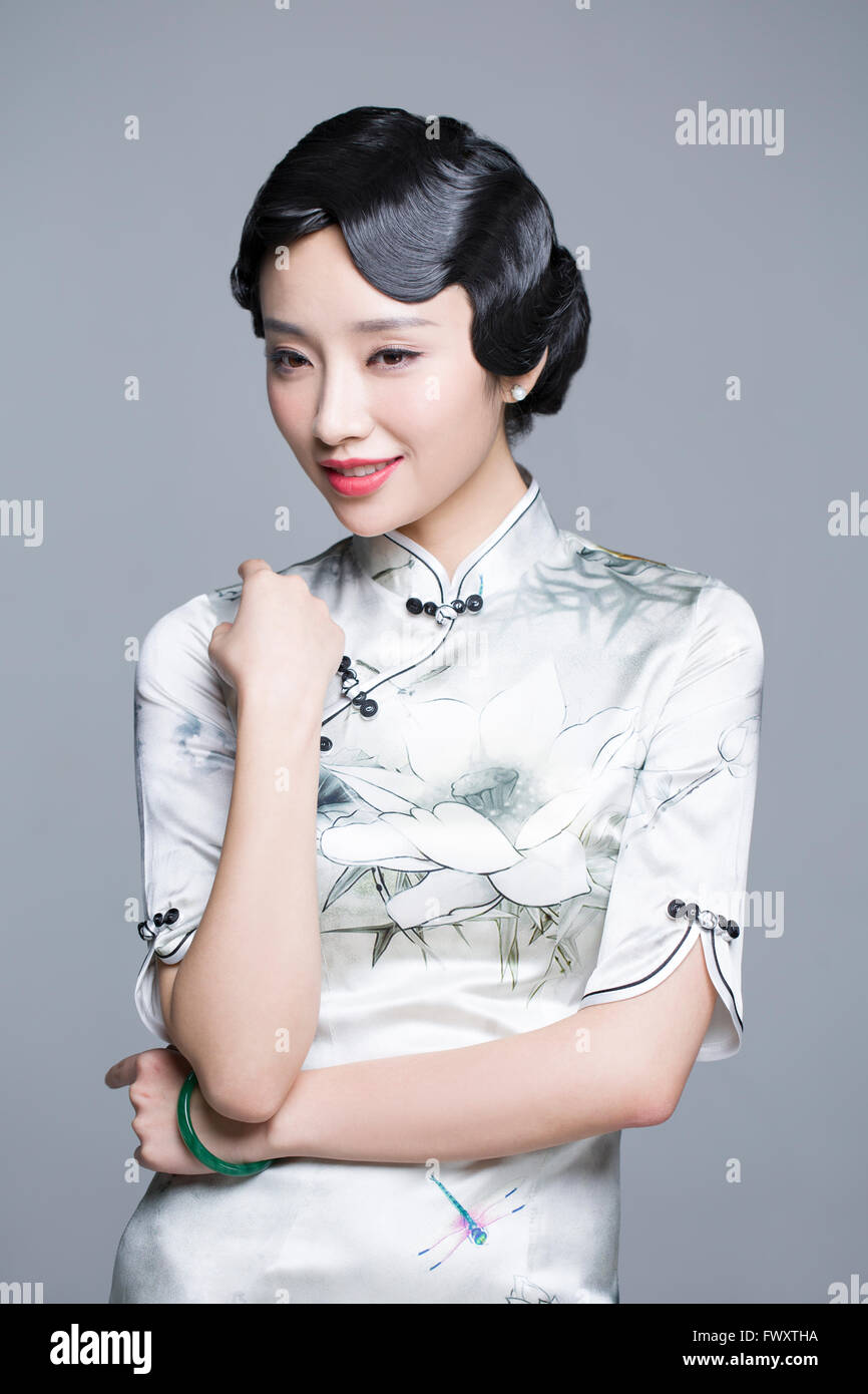 Young beautiful woman in traditional cheongsam Stock Photo - Alamy