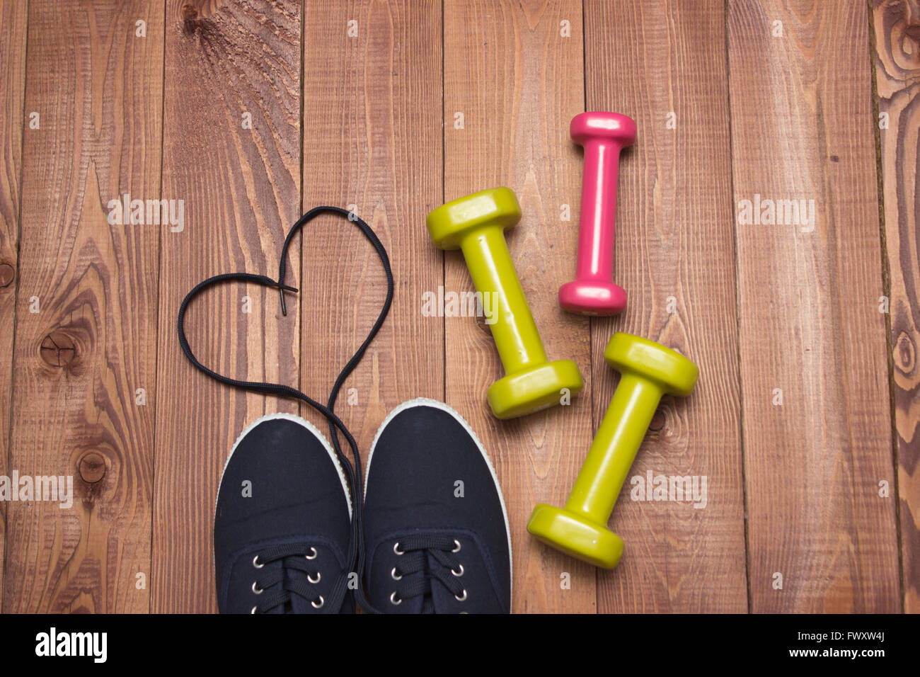 Indigo sport shoes with laces in form of a heart, green and pink ...