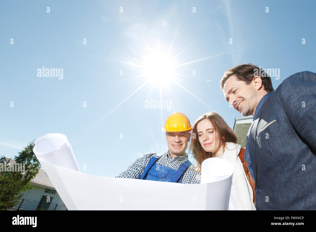 Worker holding house plan hi-res stock photography and images - Alamy