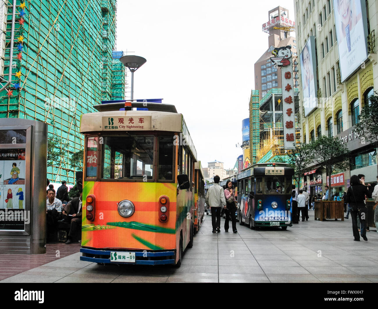 City Sightseeing trams running in the shopping distrist of downtown ...