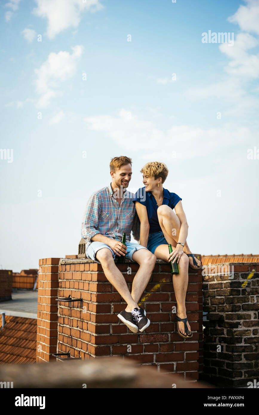 People sitting on roof hi-res stock photography and images - Alamy