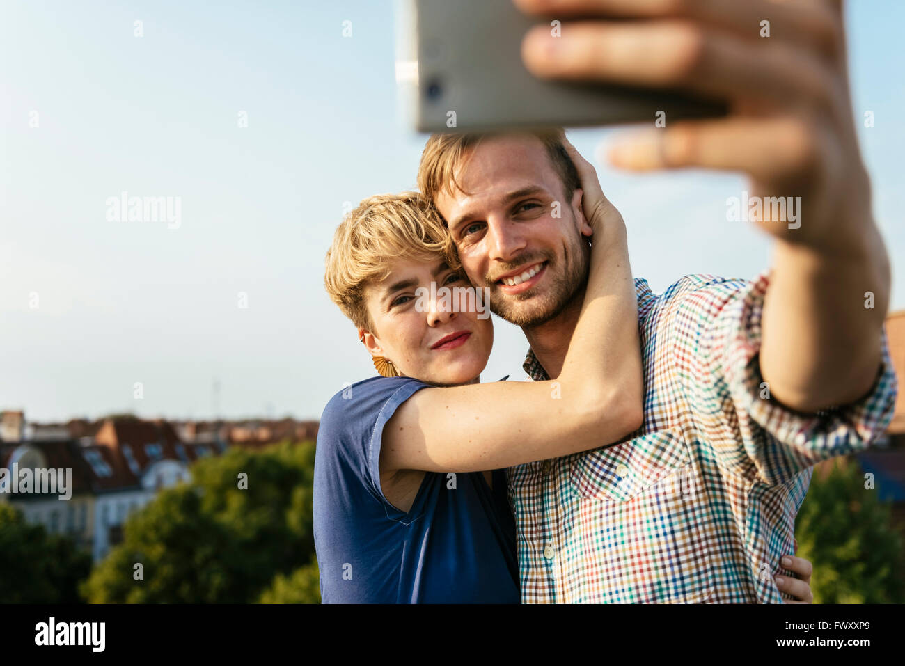Mobile hugging hi-res stock photography and images - Alamy