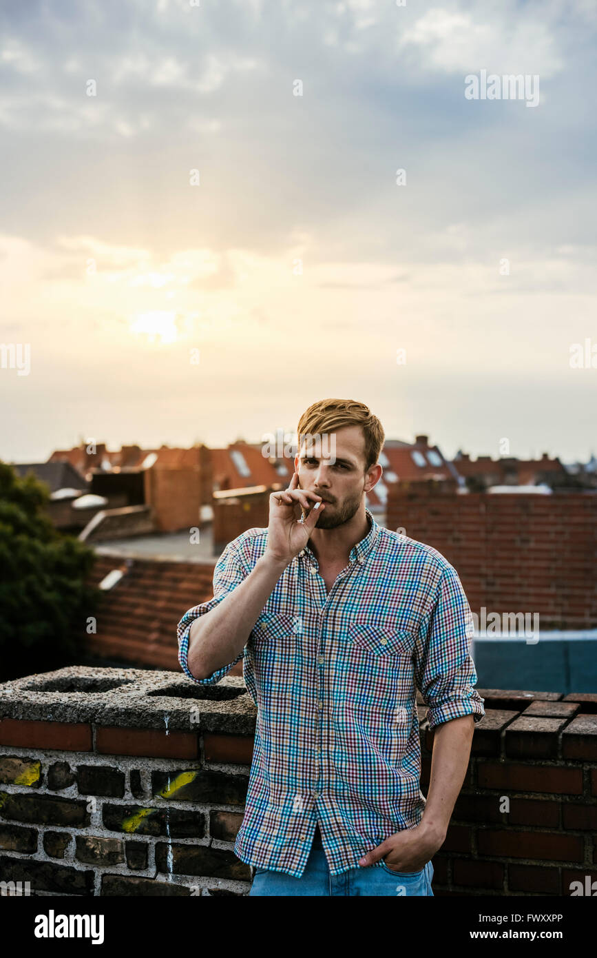 Rooftop man hi-res stock photography and images - Alamy
