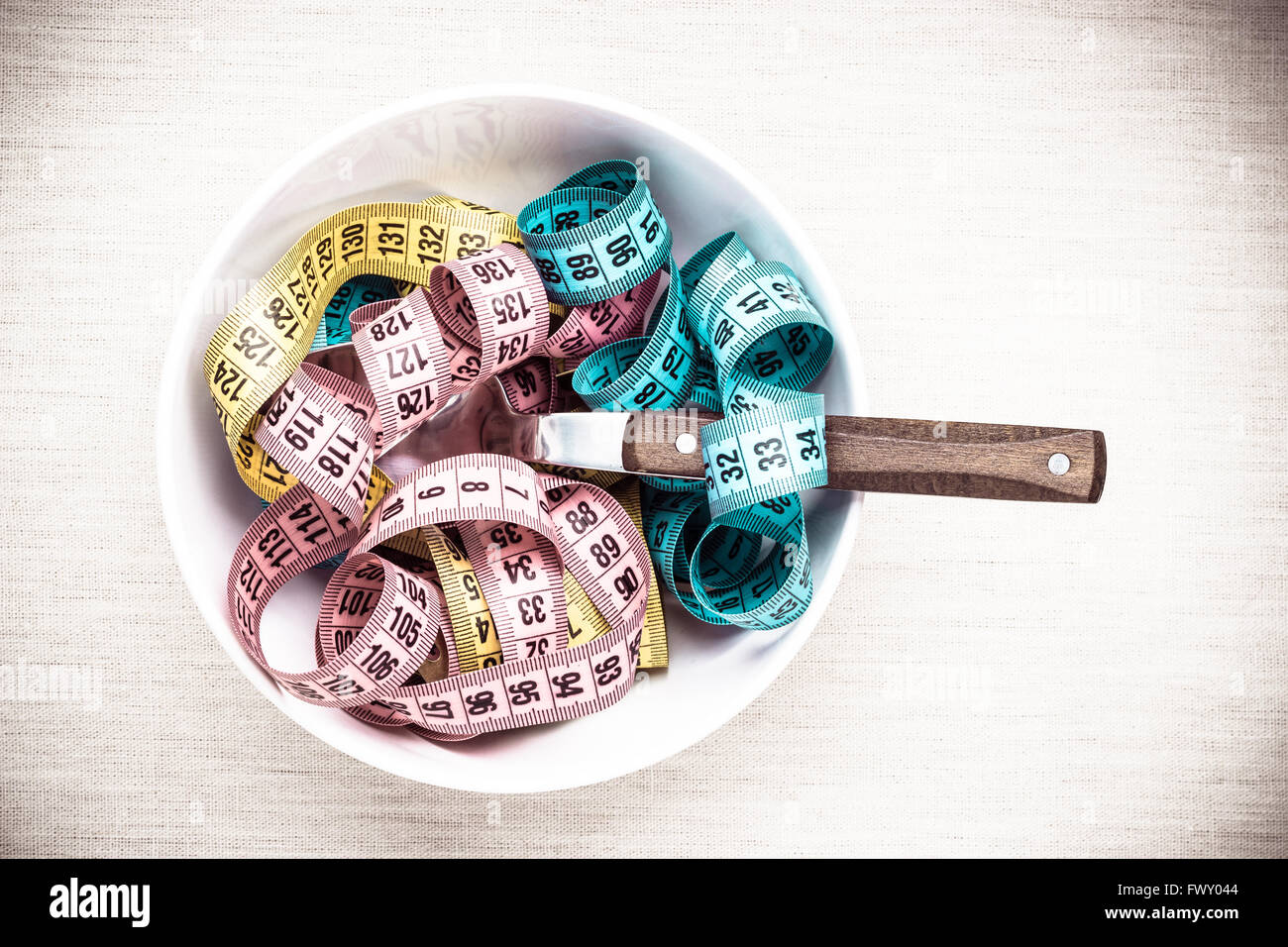 Diet food healthy lifestyle and slim body concept. Many measuring tapes ...