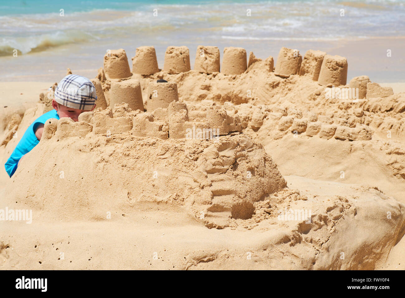 Boy building sandcastle on beach hi-res stock photography and images ...