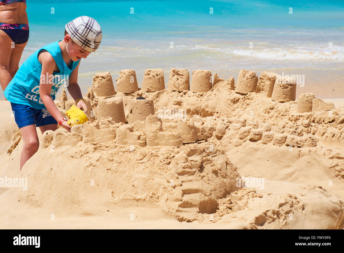 Boy building sandcastle on beach hi-res stock photography and images ...
