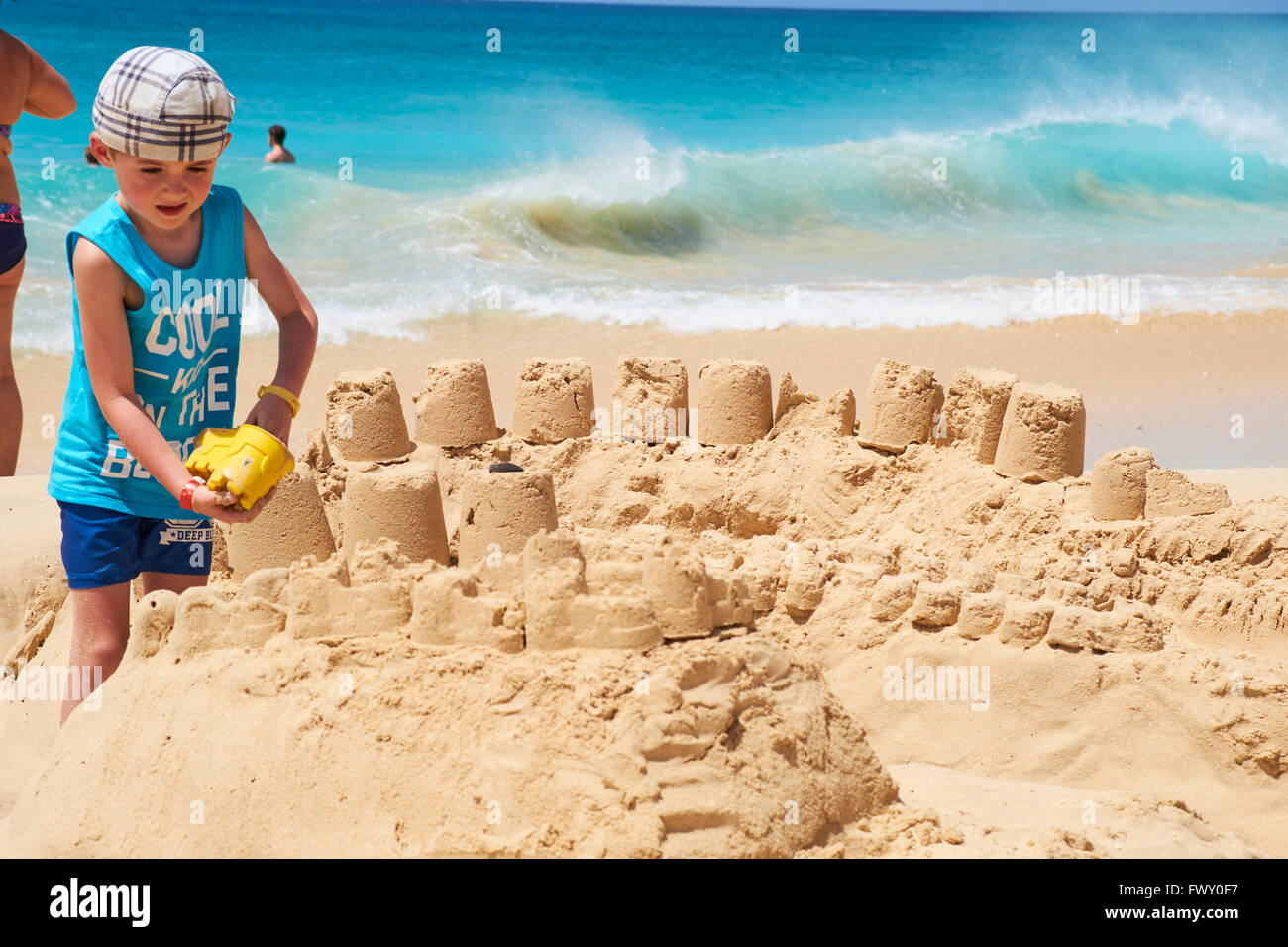Boy building sandcastle on beach hi-res stock photography and images ...
