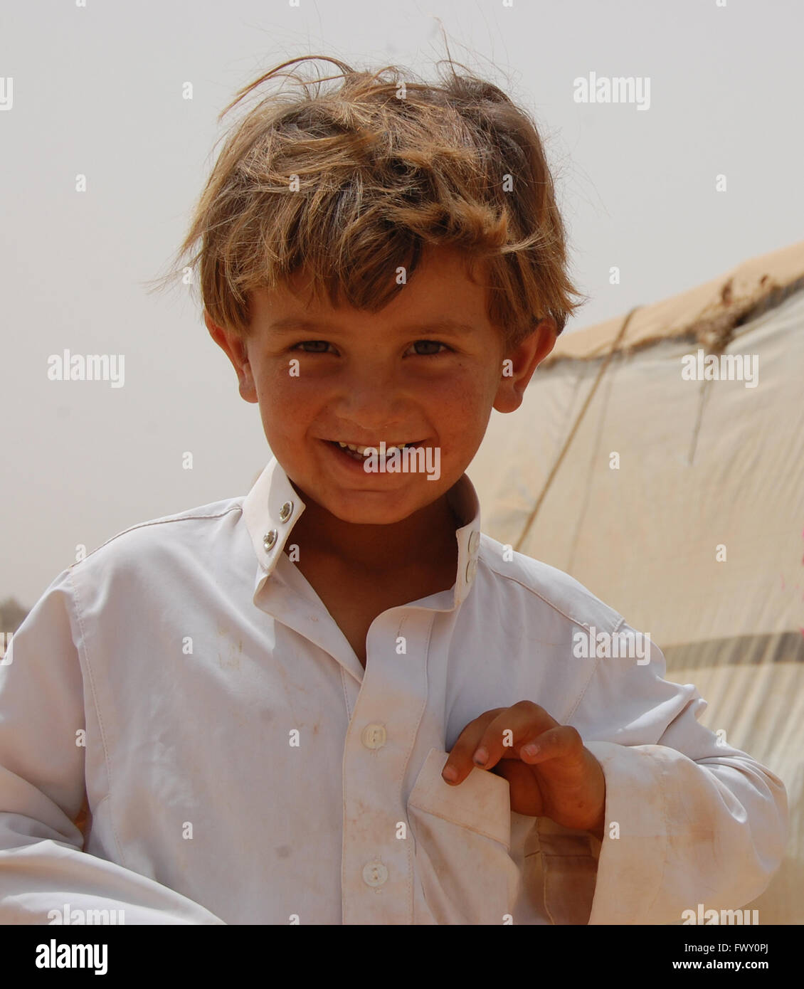 Syrian refugee boy in informal camp, Mafraq, Jordan Stock Photo - Alamy