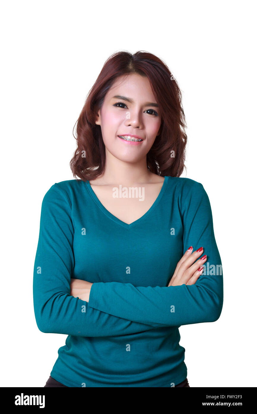 Young woman crossed arms standing against white. Confident pose Stock ...