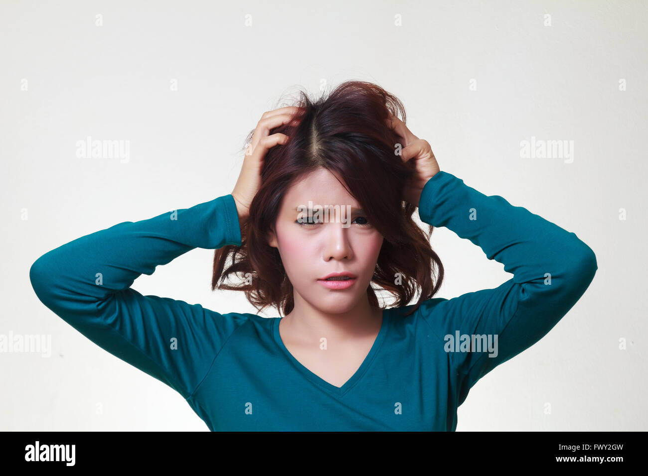 Stress. Woman stressed is going crazy pulling her hair in frustration ...