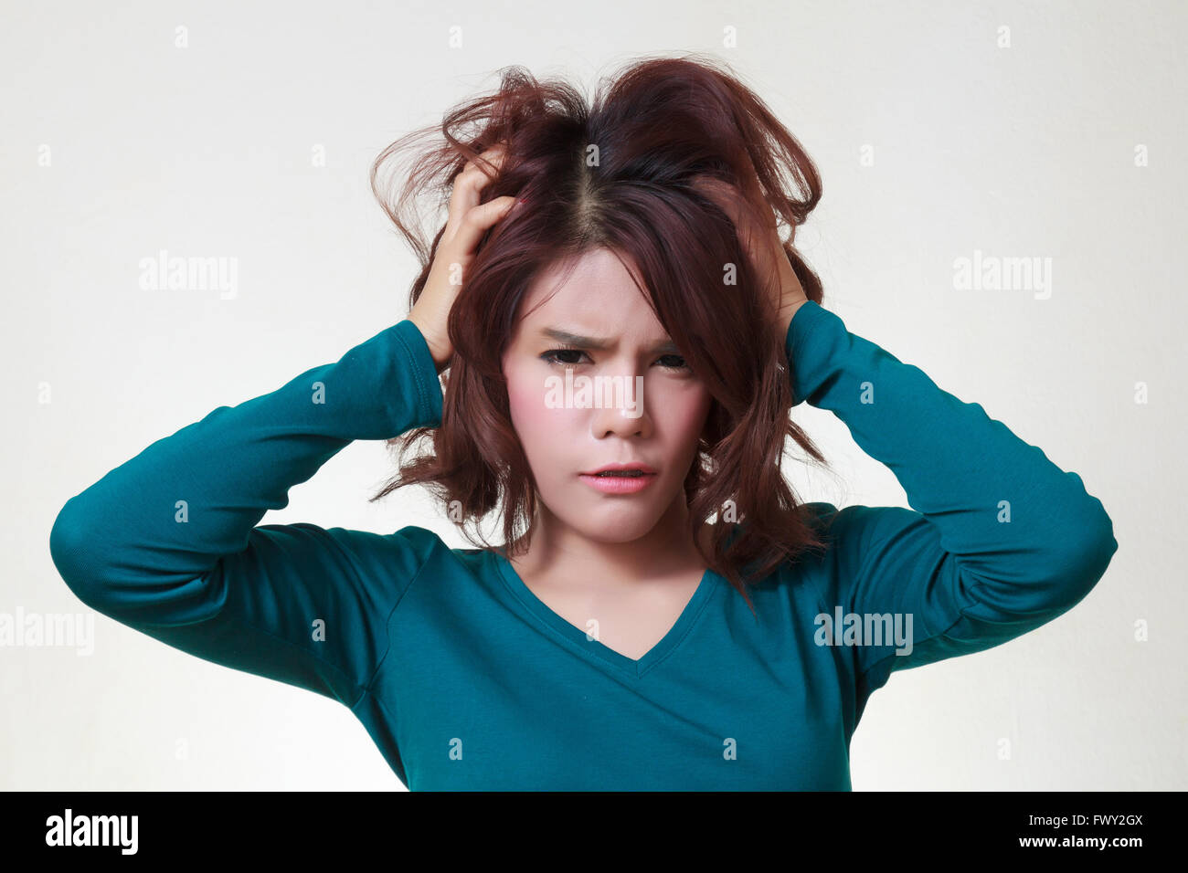 Stress. Woman stressed is going crazy pulling her hair in frustration ...