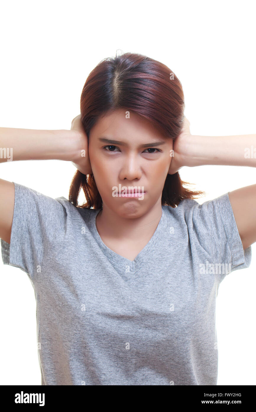 Beautiful young woman is touching her ear and closing her ears from ...