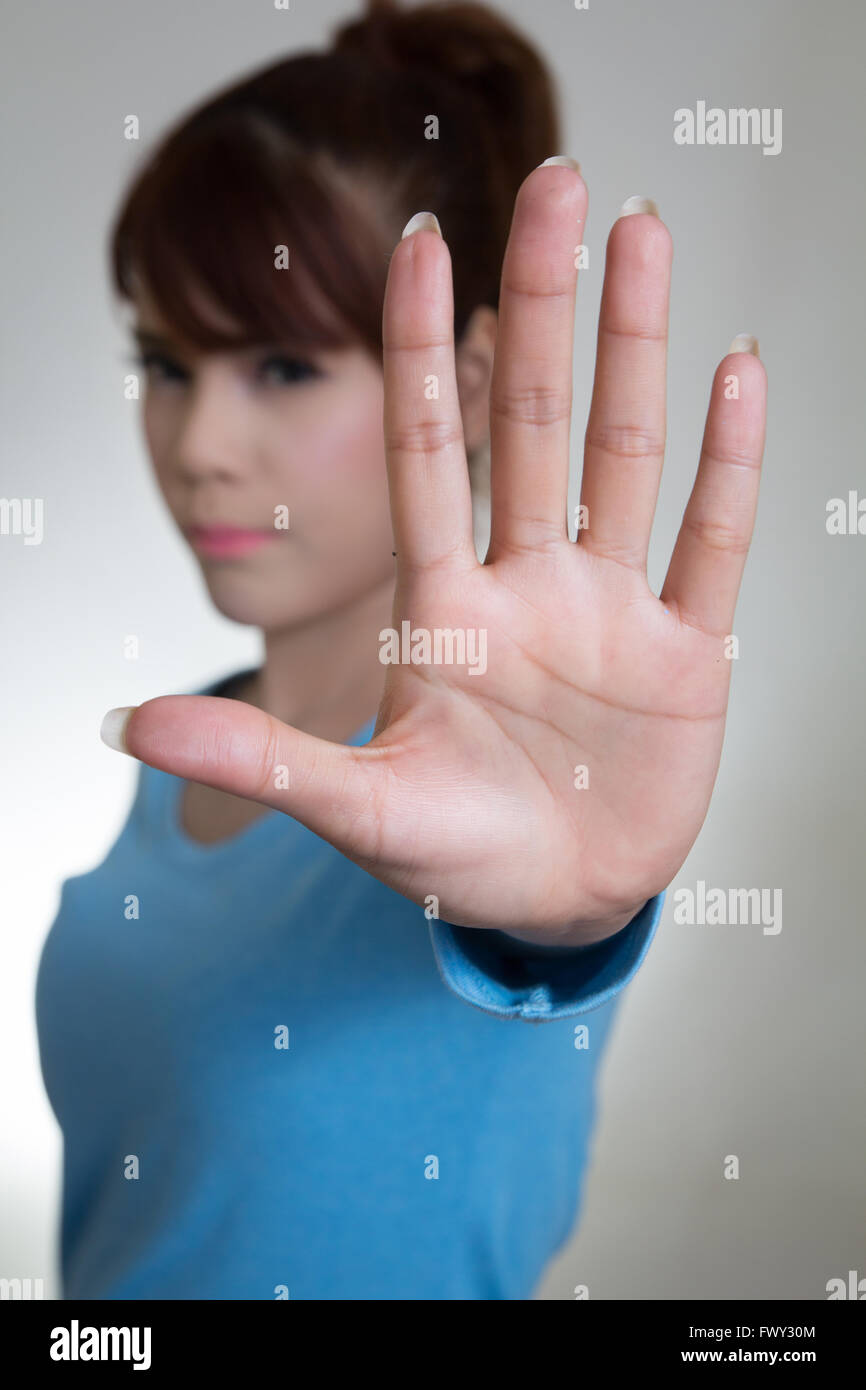 Asian women showing stop hand gesture, selective focus Stock Photo - Alamy