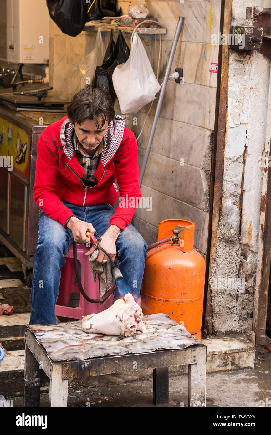 Gilan Province- Rasht IRAN-March 26 2016- A Man Removing Sheep head ...