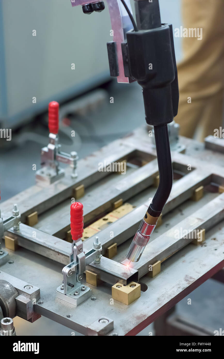 robotic hand machine tool at industrial manufacture factory Stock Photo ...