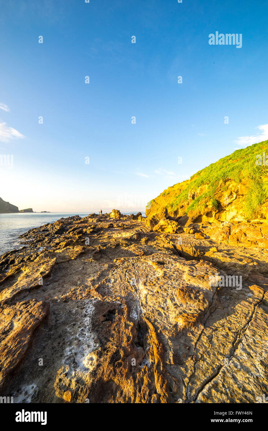 Texture of beach rocks with nature sunlight Stock Photo - Alamy