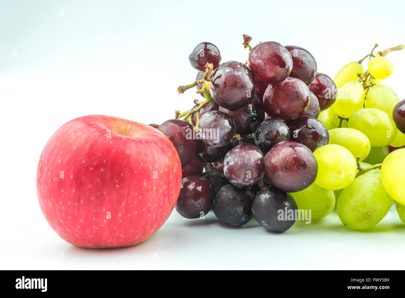 Grape and apple with white background Stock Photo - Alamy
