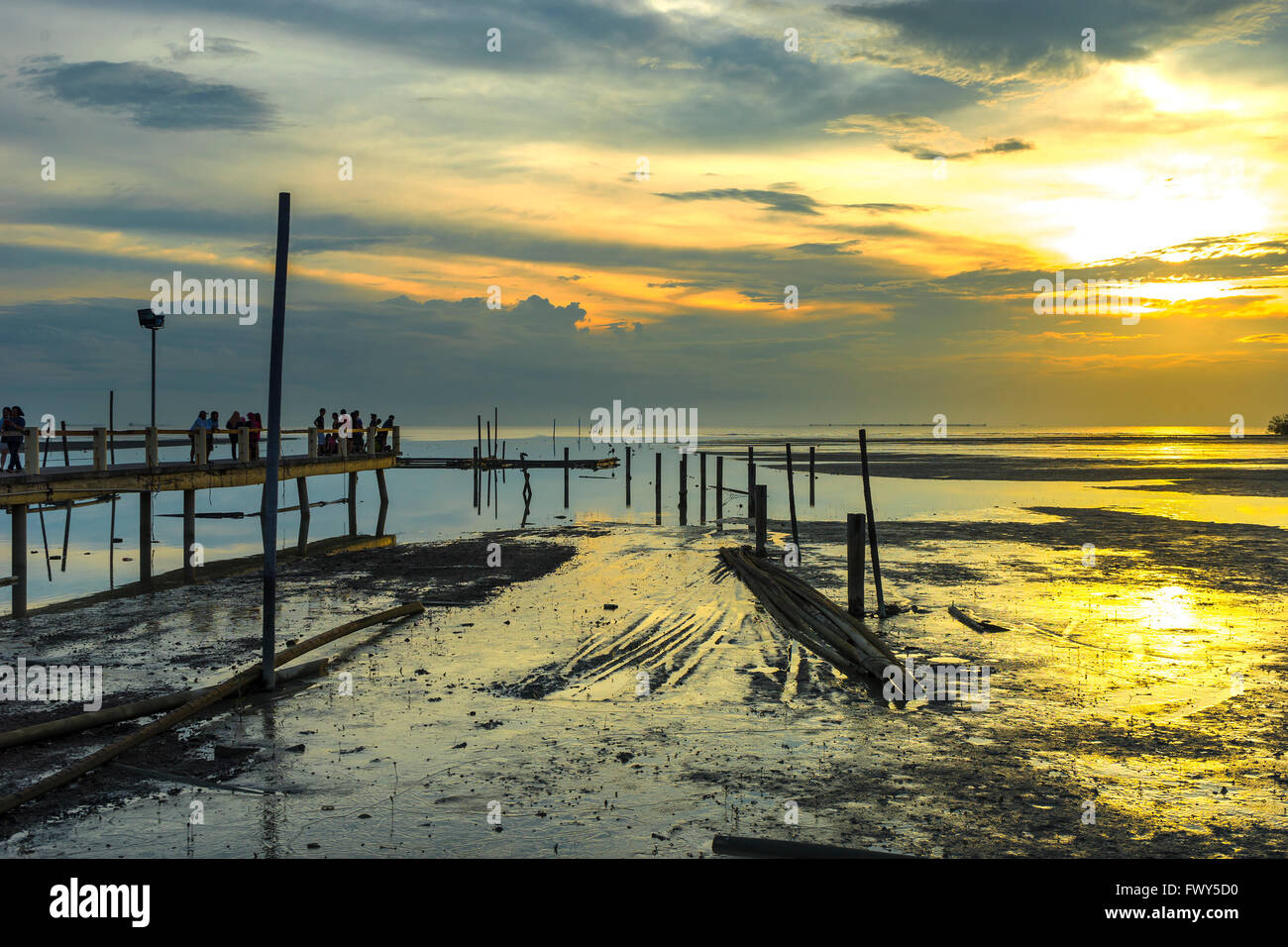 Jetty with sunset background Stock Photo - Alamy