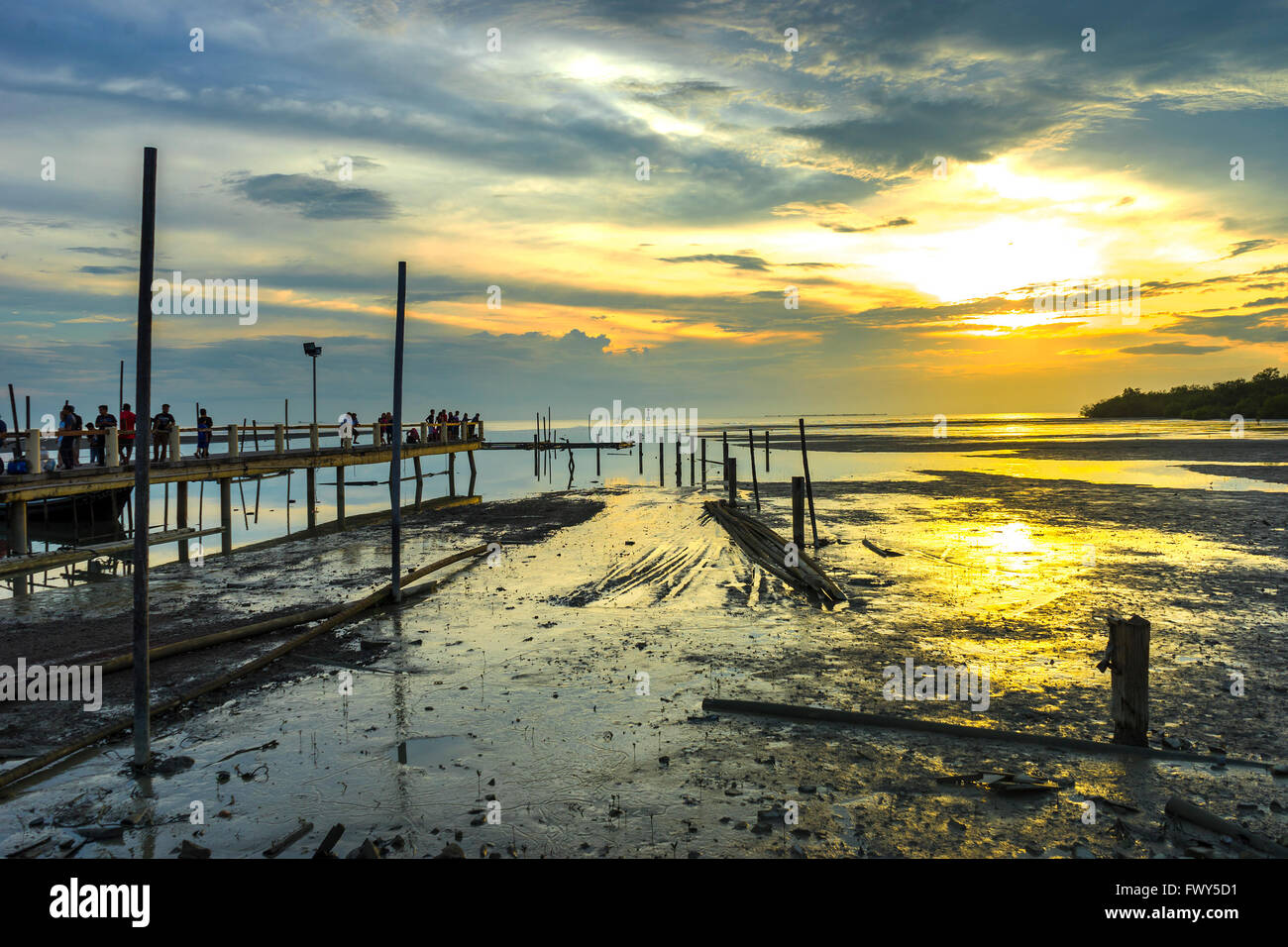 Jetty with sunset background Stock Photo - Alamy
