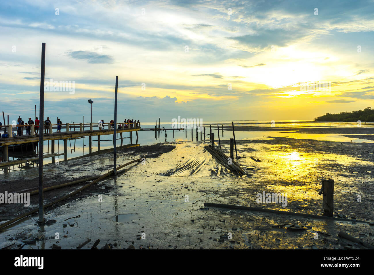 Jetty with sunset background Stock Photo - Alamy