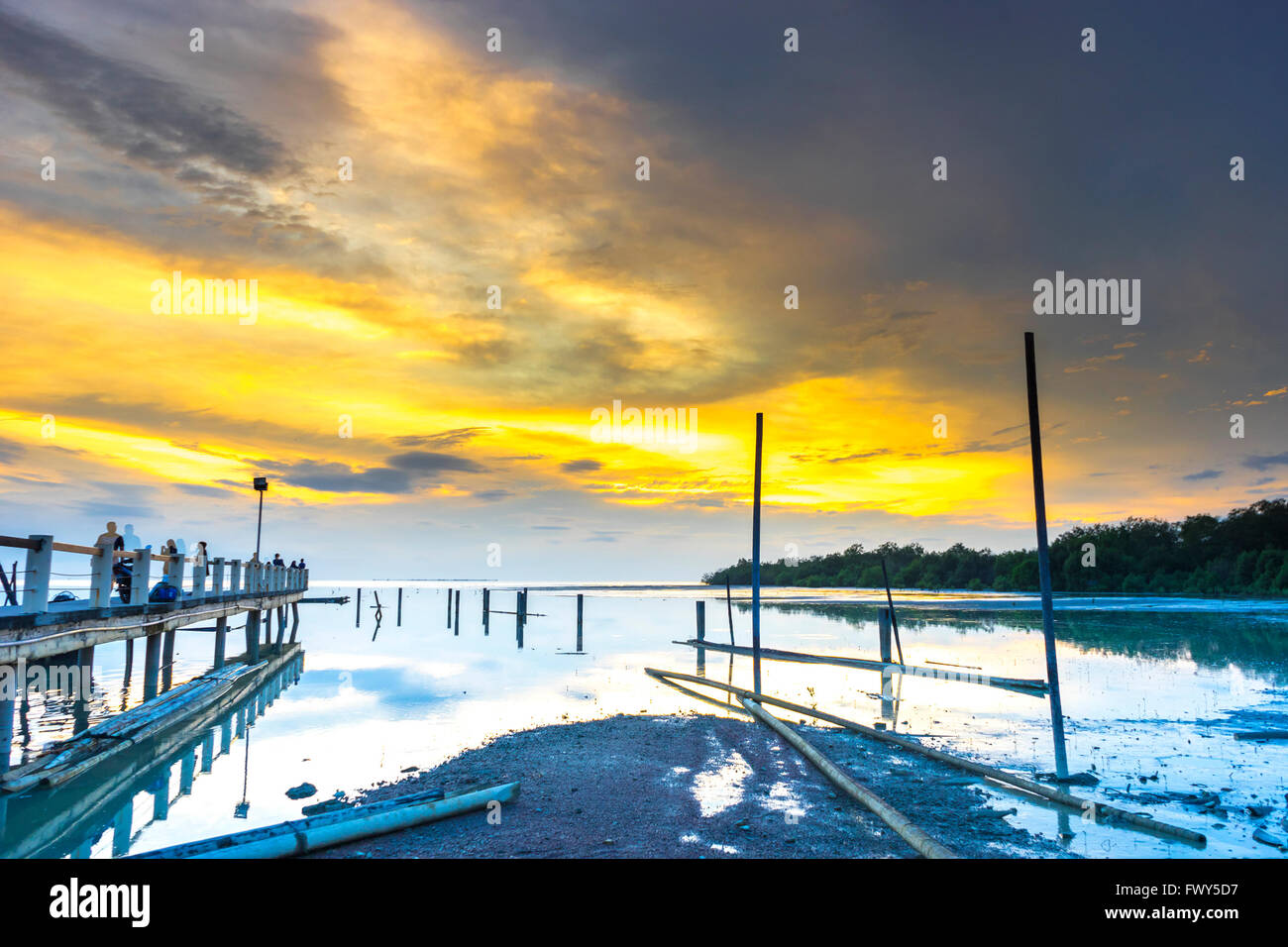jetty with sunset background Stock Photo - Alamy