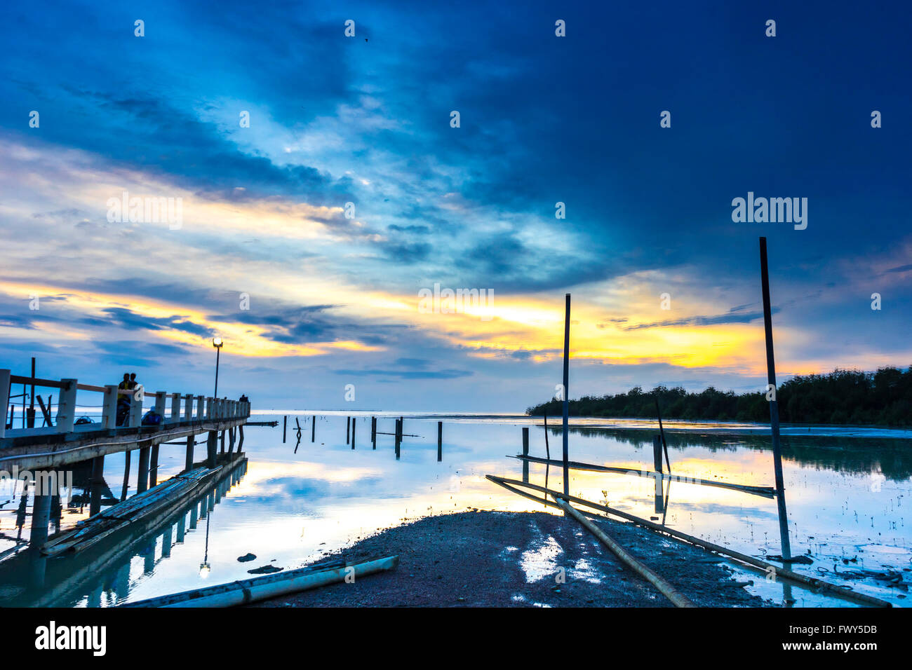 Jetty silhouette with sunset background in blue hour view Stock Photo ...