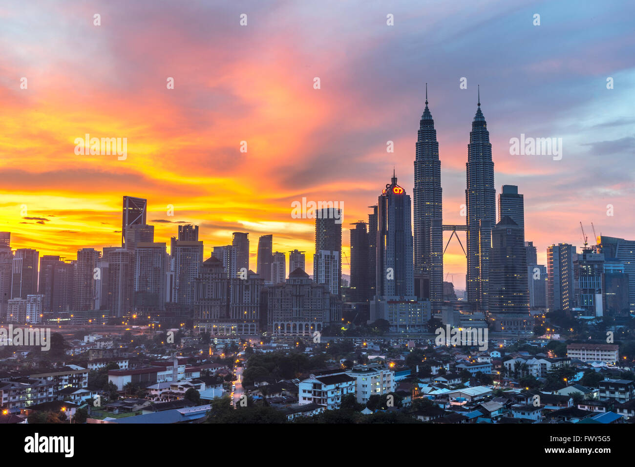 KUALA LUMPUR, MALAYSIA - DEC 6, 2015: The KLCC Twin Towers with orange ...