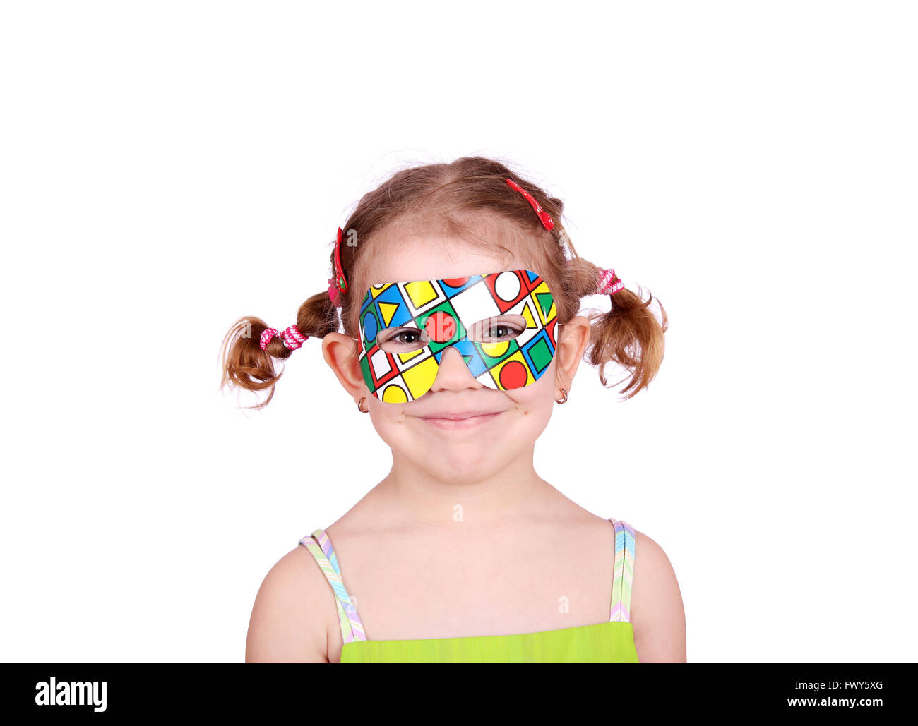 happy little girl with colorful party mask Stock Photo - Alamy