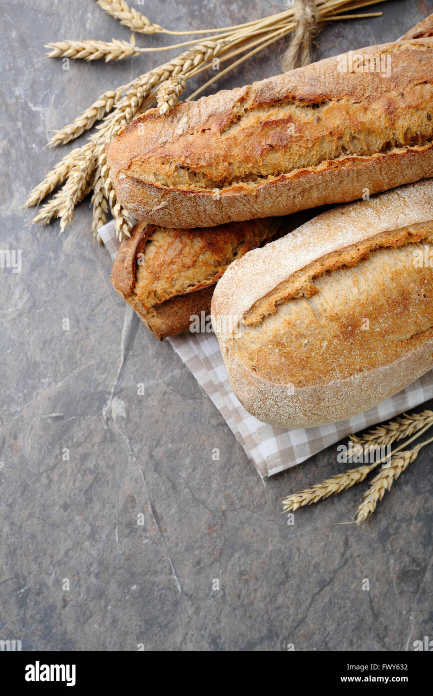 loaves of bread on slate, food close-up Stock Photo - Alamy