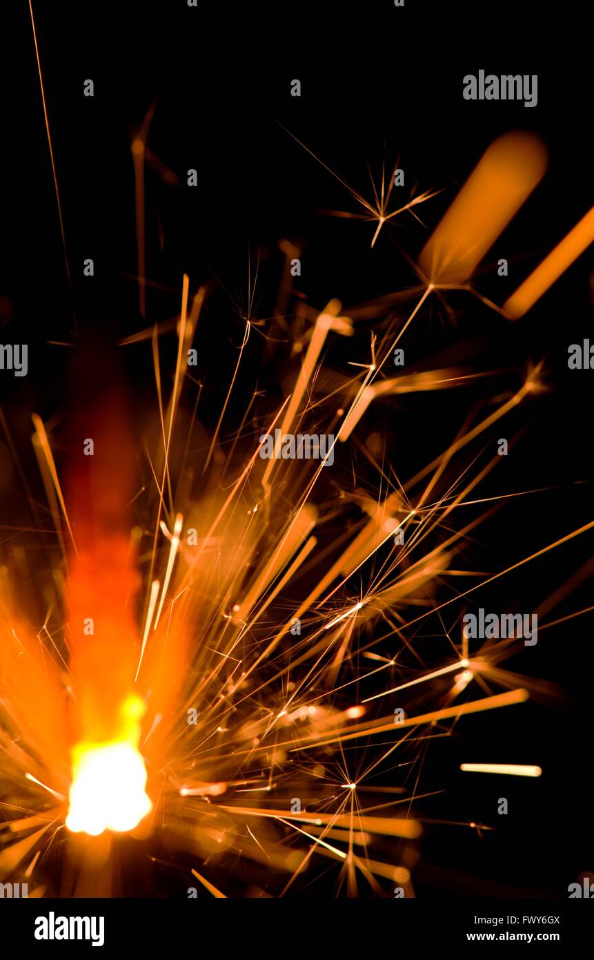 Glowing sparkler in the dark on Christmas Stock Photo - Alamy