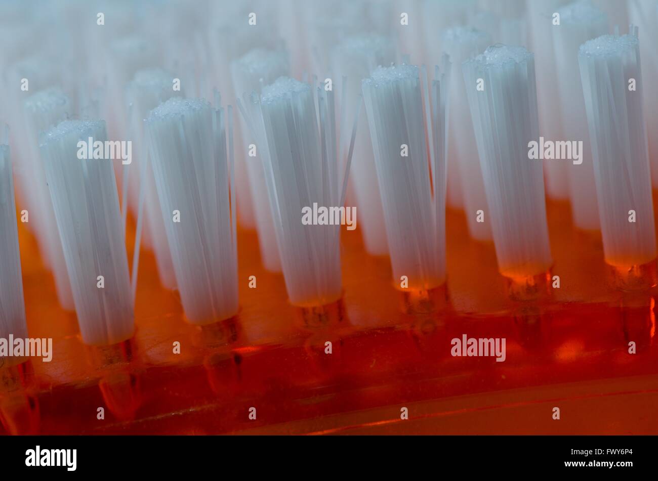 Brush with white bristles, closeup texture background Stock Photo - Alamy