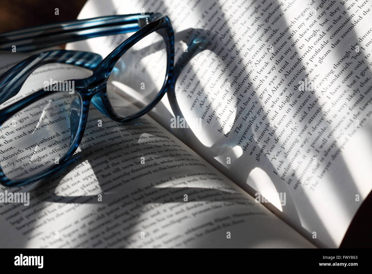 book glasses sunlight shadow Stock Photo - Alamy