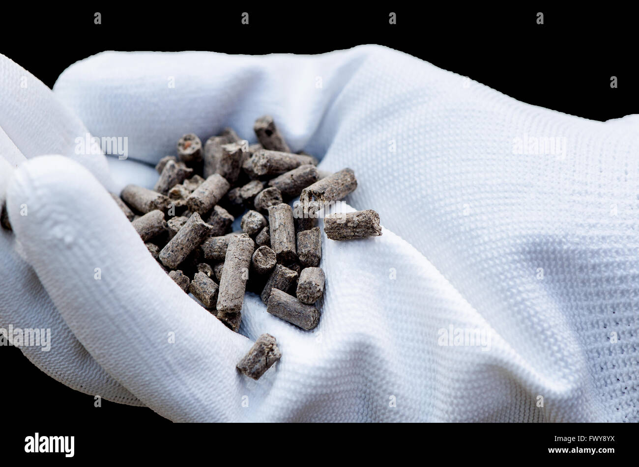 Brown manure granules in white gloves on farmer's hands Stock Photo - Alamy