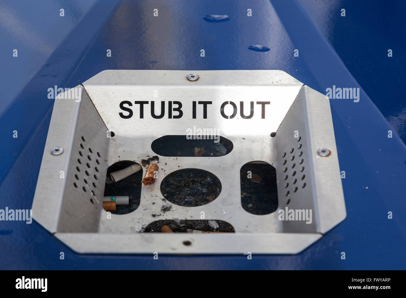 Outside metal cigarette ash tray marked 'stub it out' Stock Photo - Alamy