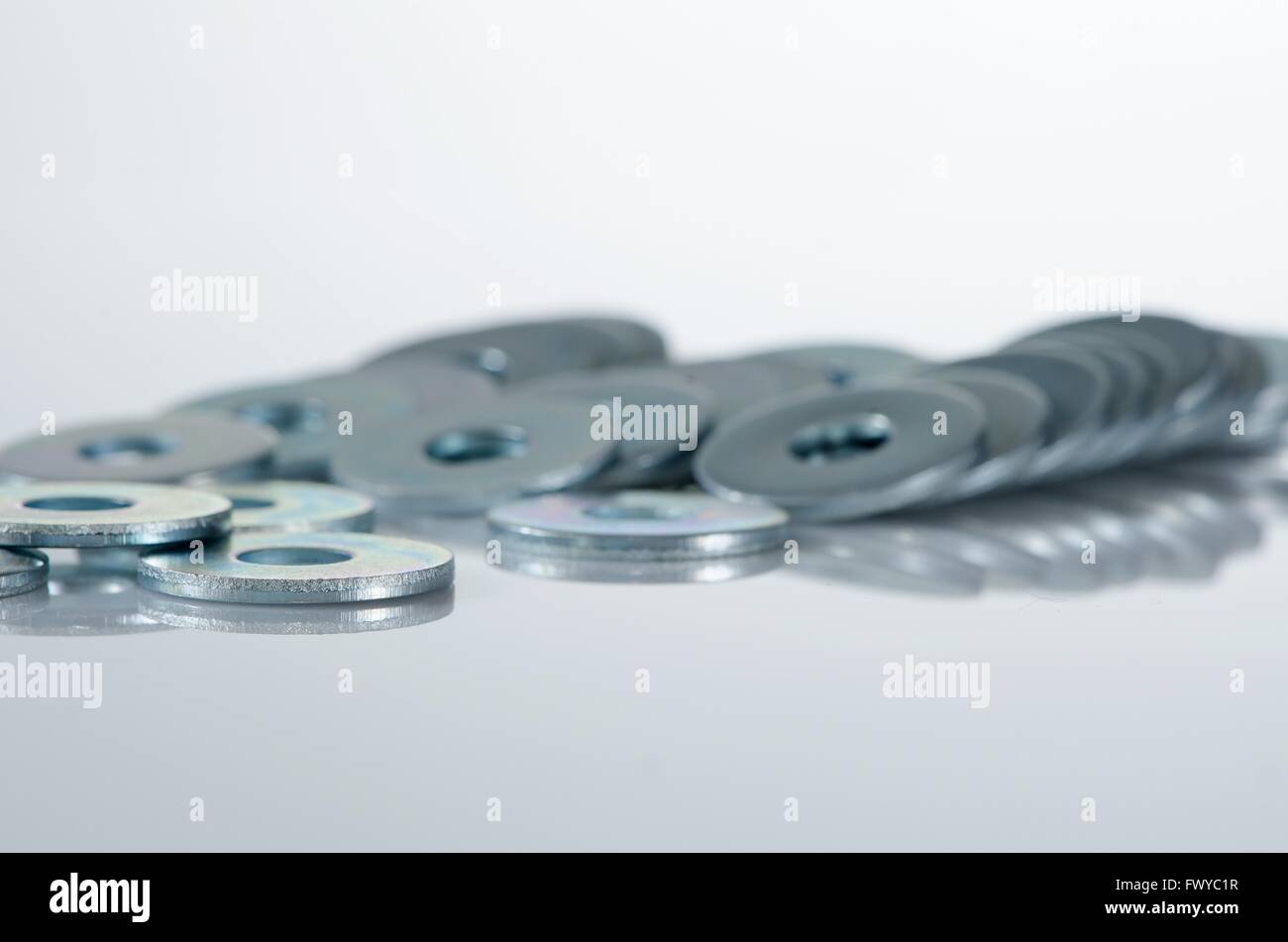 Lot of screw washers isolated on white background Stock Photo - Alamy