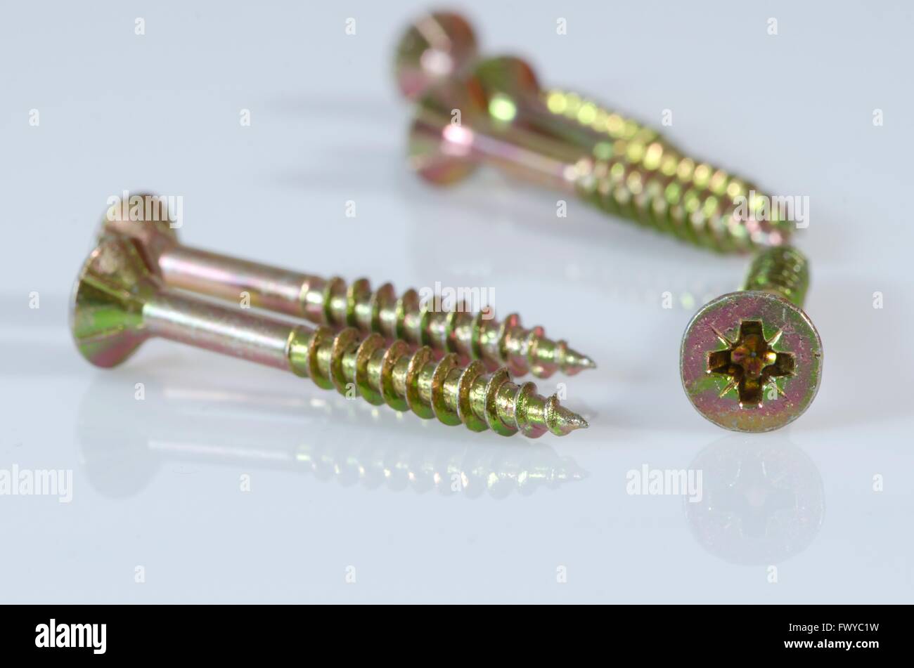 Six golden screws isolated on white background with reflection Stock ...