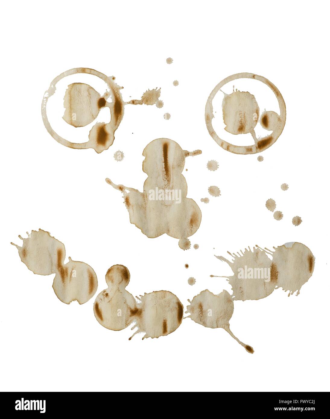 Lot of coffee stains as face shape on white background Stock Photo - Alamy