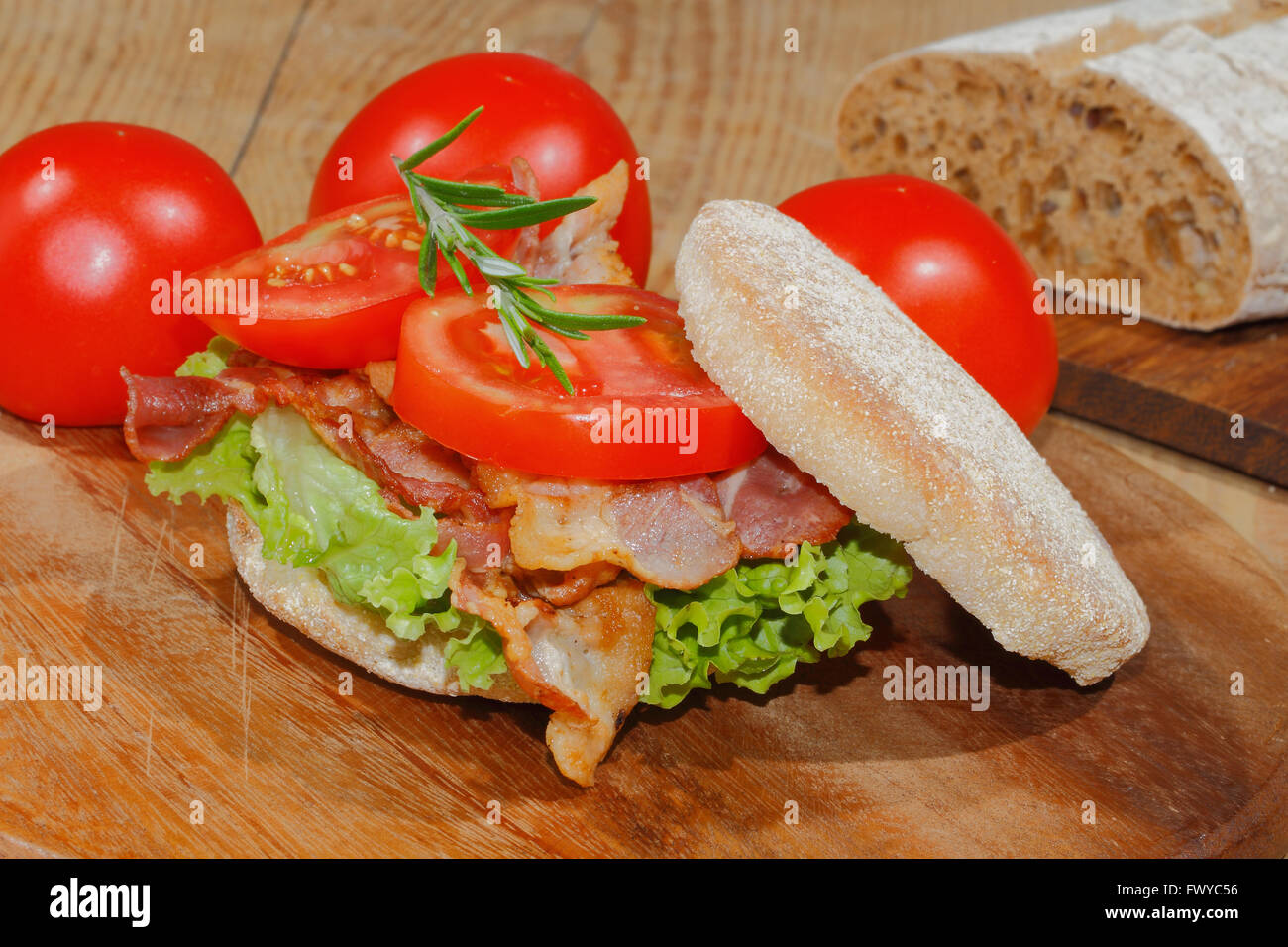 Toast, toast bread with bacon, ham garnished with tomatoes, lettuce and ...