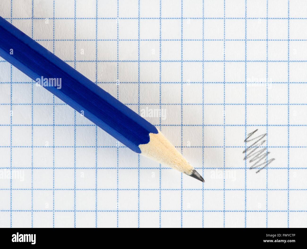 Blue pencil on square paper and stroke Stock Photo - Alamy