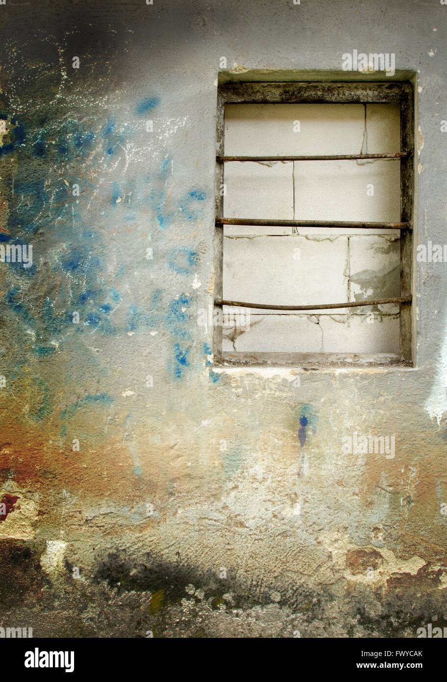 Old damage wall and built-in window with bar Stock Photo - Alamy