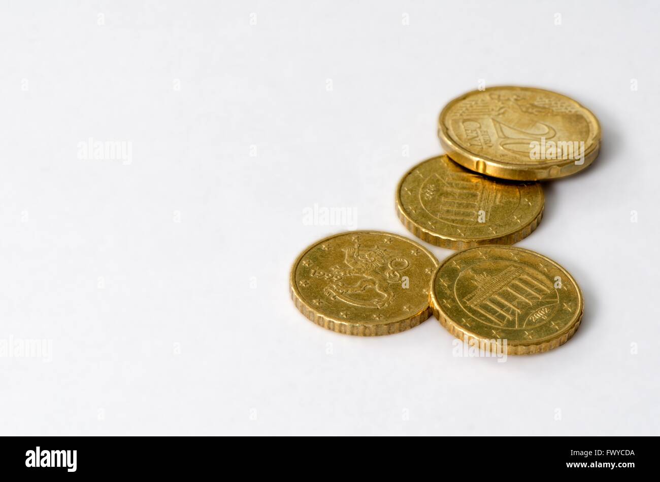 Four euro coins isolated on white background Stock Photo - Alamy