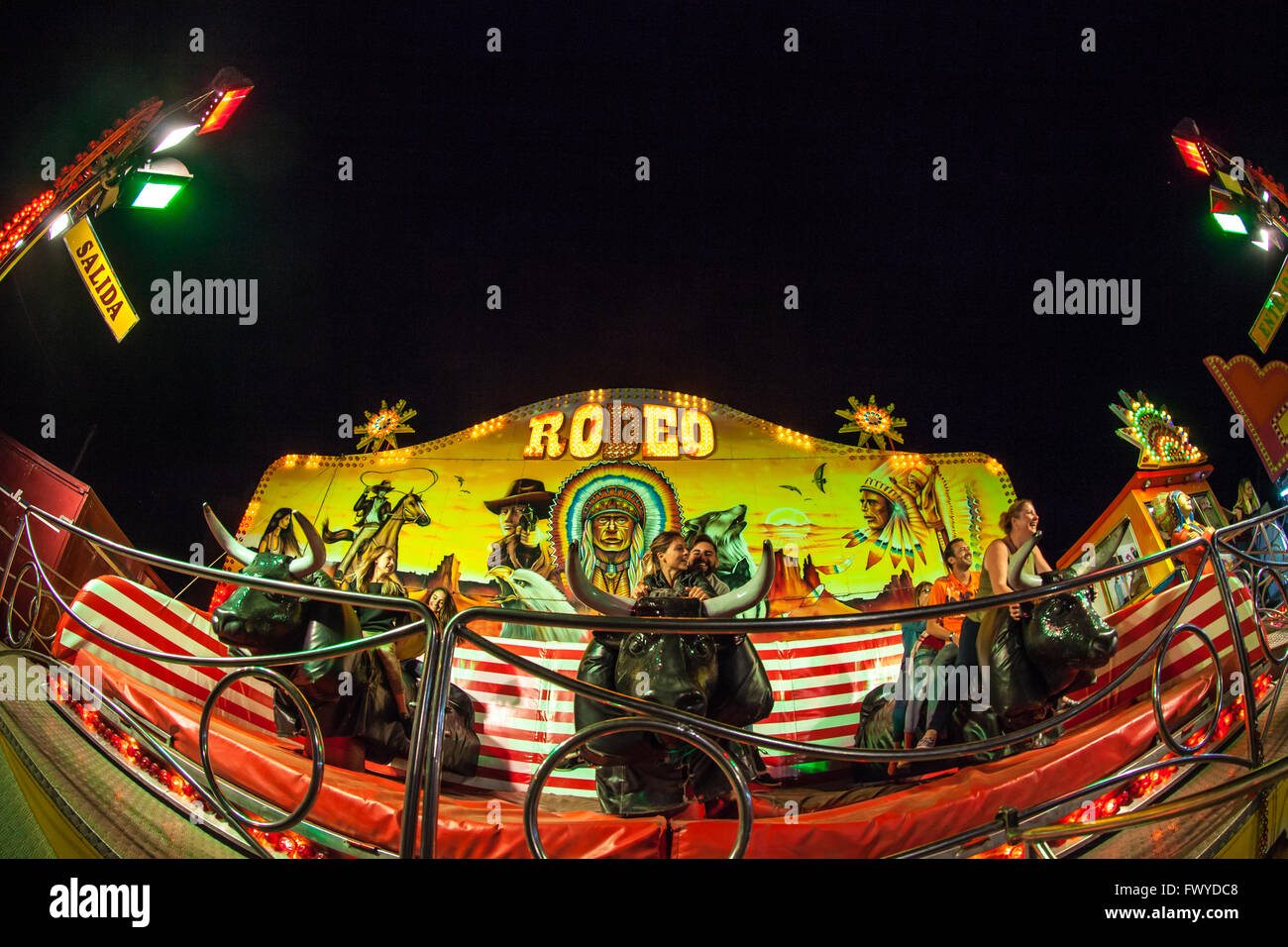 people having fun in a fairground attraction Stock Photo - Alamy