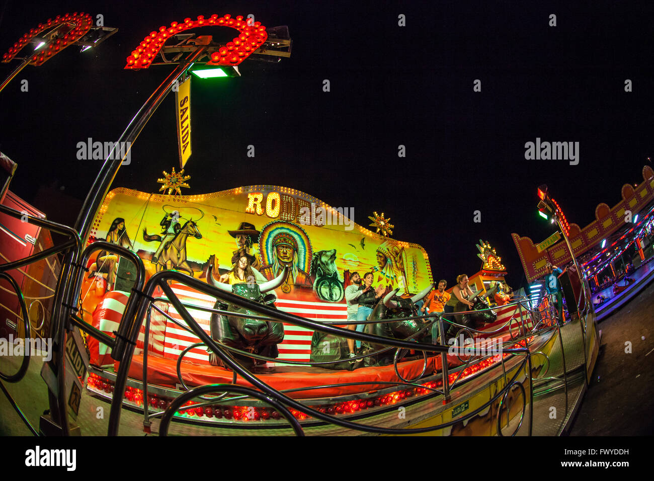 people having fun in a fairground attraction Stock Photo - Alamy